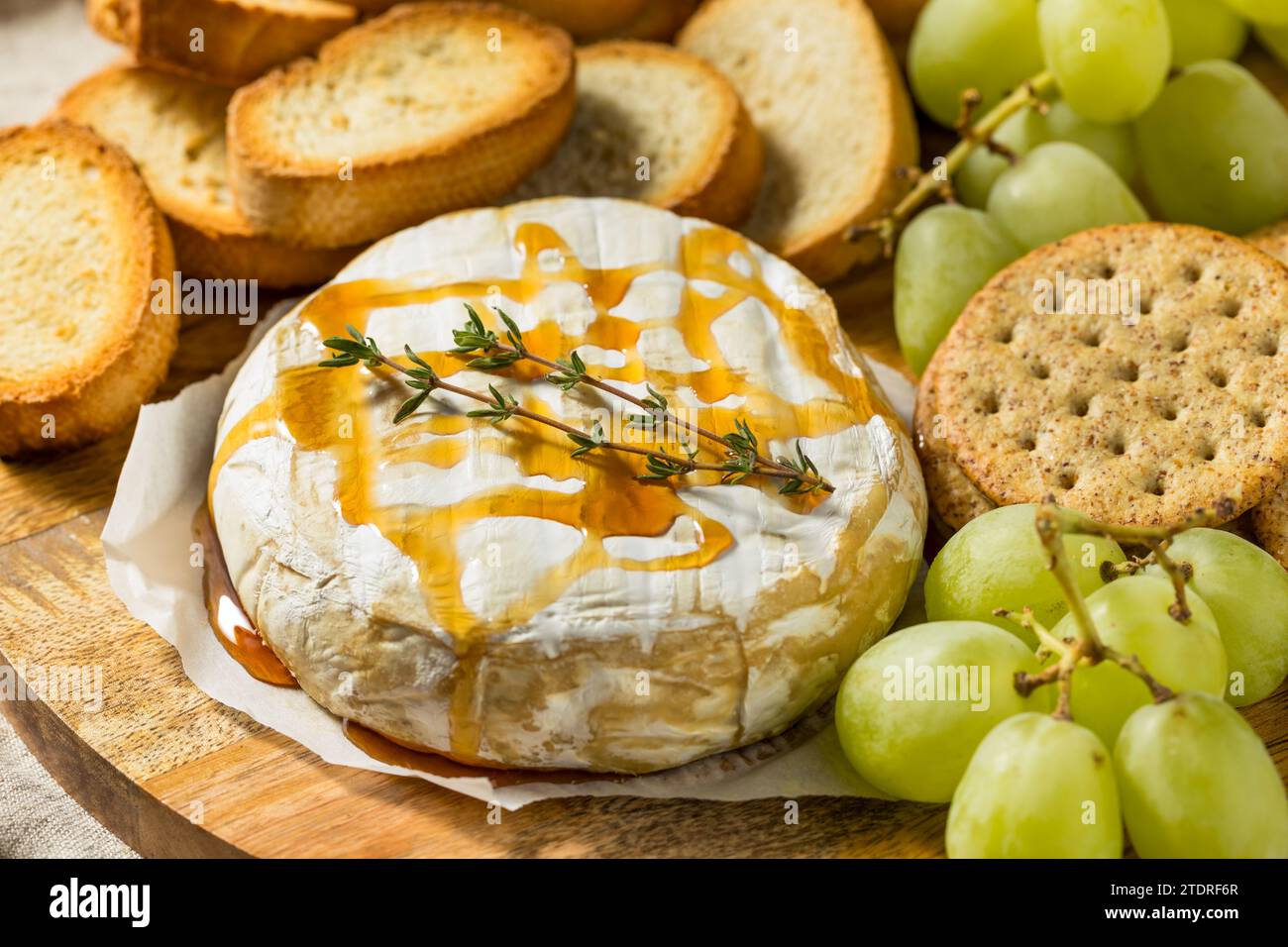 Homemade Baked Brie Appetizer with Grapes and Crackers Stock Photo - Alamy