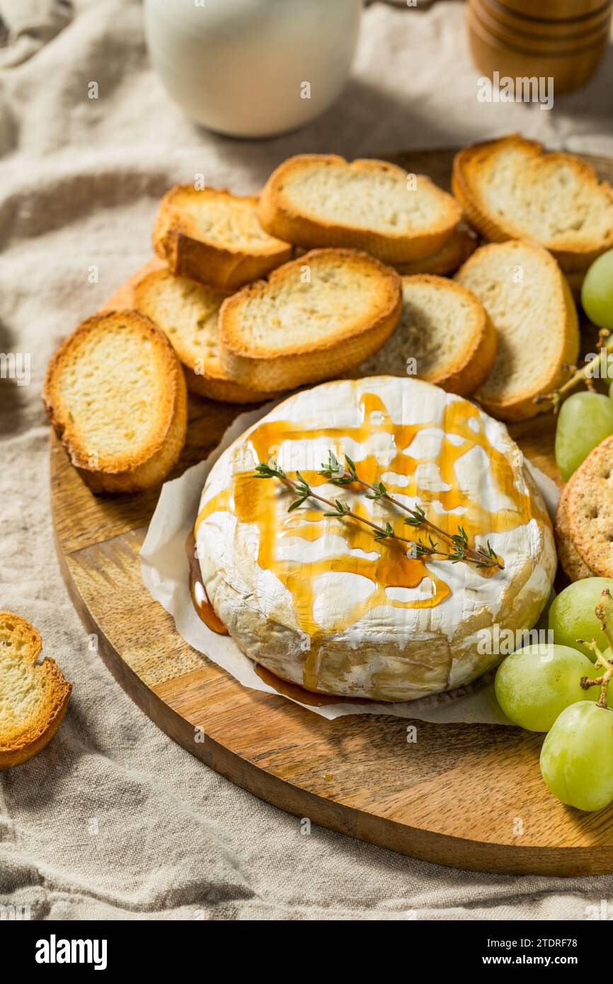 Homemade Baked Brie Appetizer with Grapes and Crackers Stock Photo - Alamy