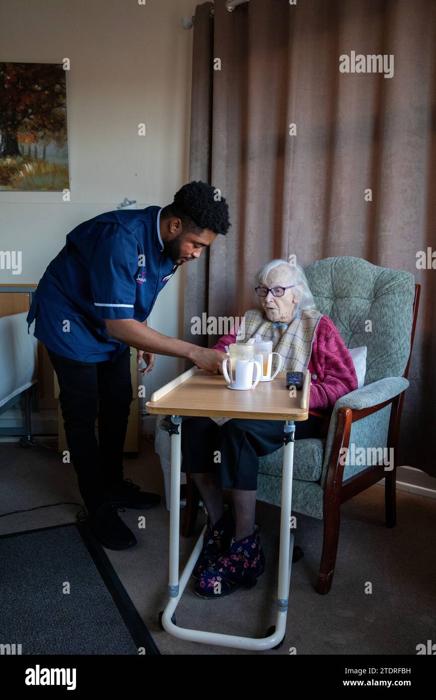 Ghanaian Nurse Evans Sarbeng with resident Phyllis Padham (97) at St ...