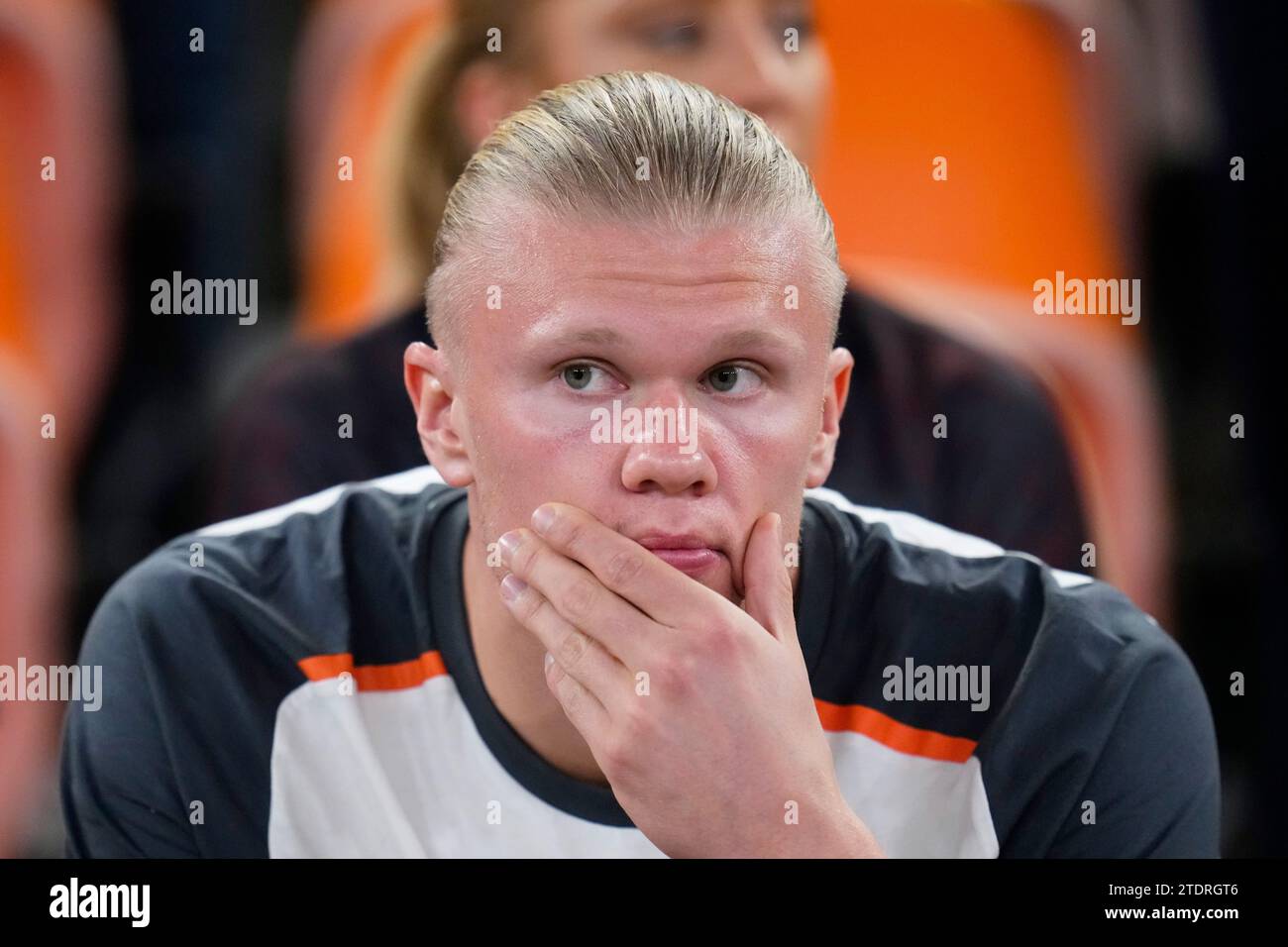 Manchester City's Erling Haaland, siting on the stands, watches the ...