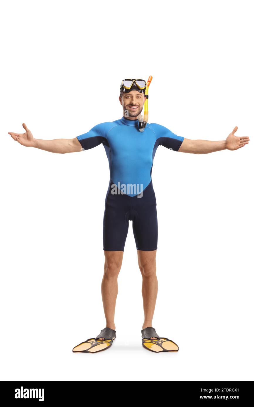 Man wearing a diving suit, mask and fins spreading arms and smiling ...