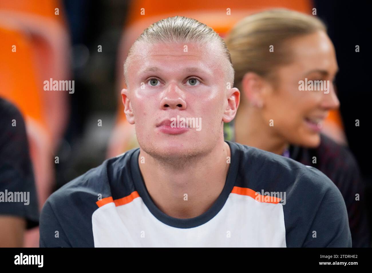 Manchester City's Erling Haaland, siting on the stands, watches the ...