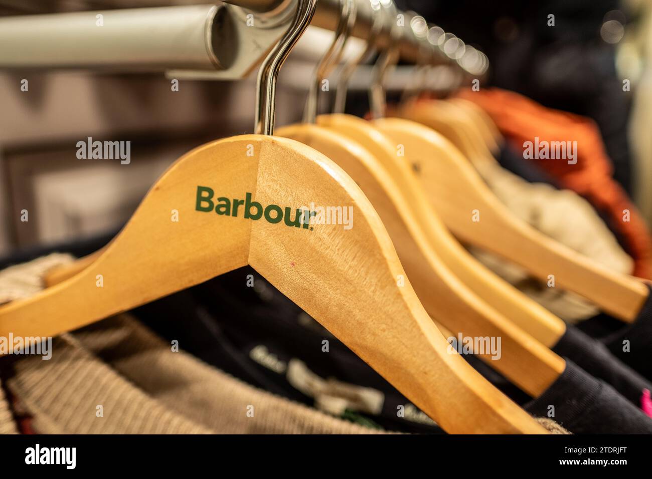 LONDON- DECEMBER 14, 2023: Barbour logo on clothes rail hanger ...