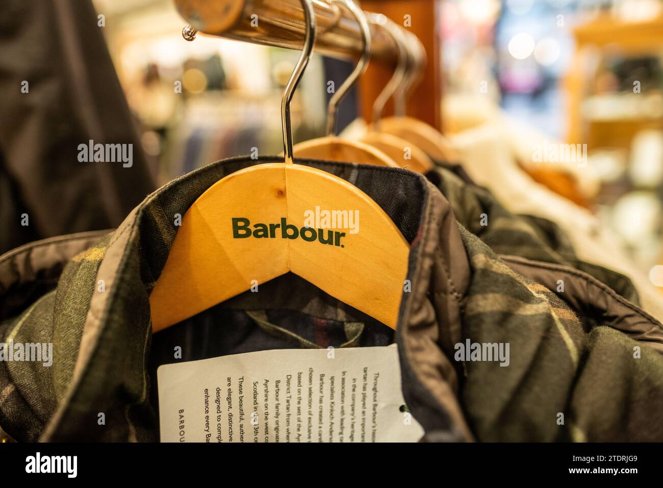 LONDON- DECEMBER 14, 2023: Barbour logo on clothes rail hanger ...