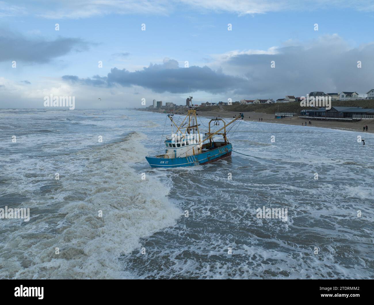Aerial drone view of a stranded small shrimp trawler fishing boat at a ...