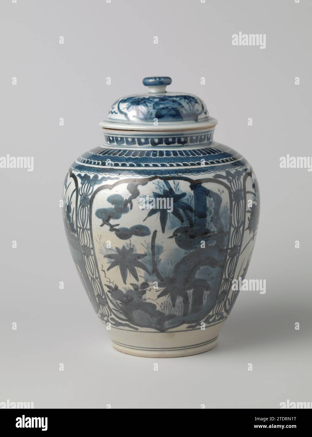 Ovoid covered jar with flowering plants in panels and ornamental ...