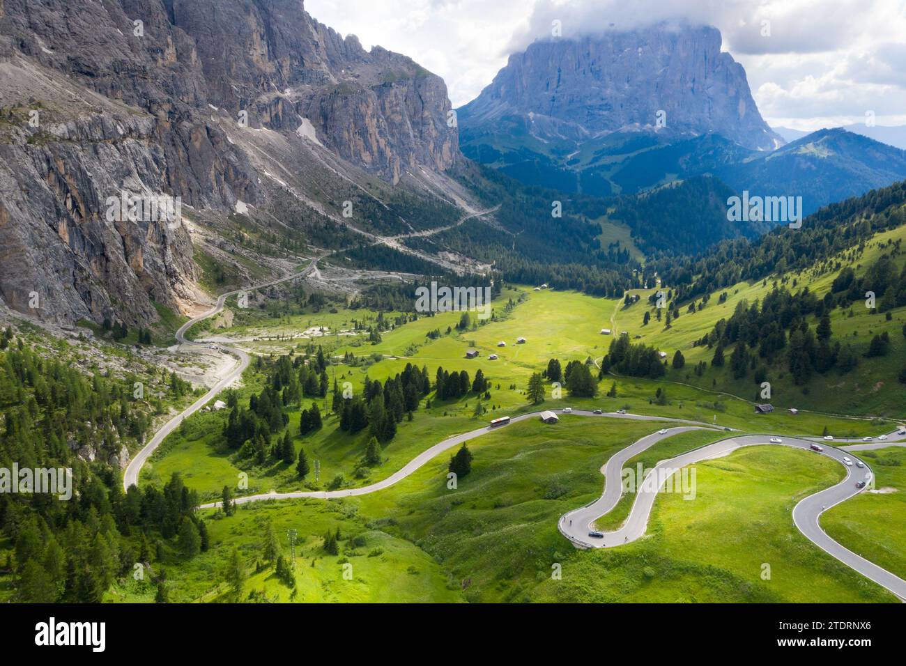 Aerial drone shot of picturesque Dolomite Alps ridges and peaks. Passo ...