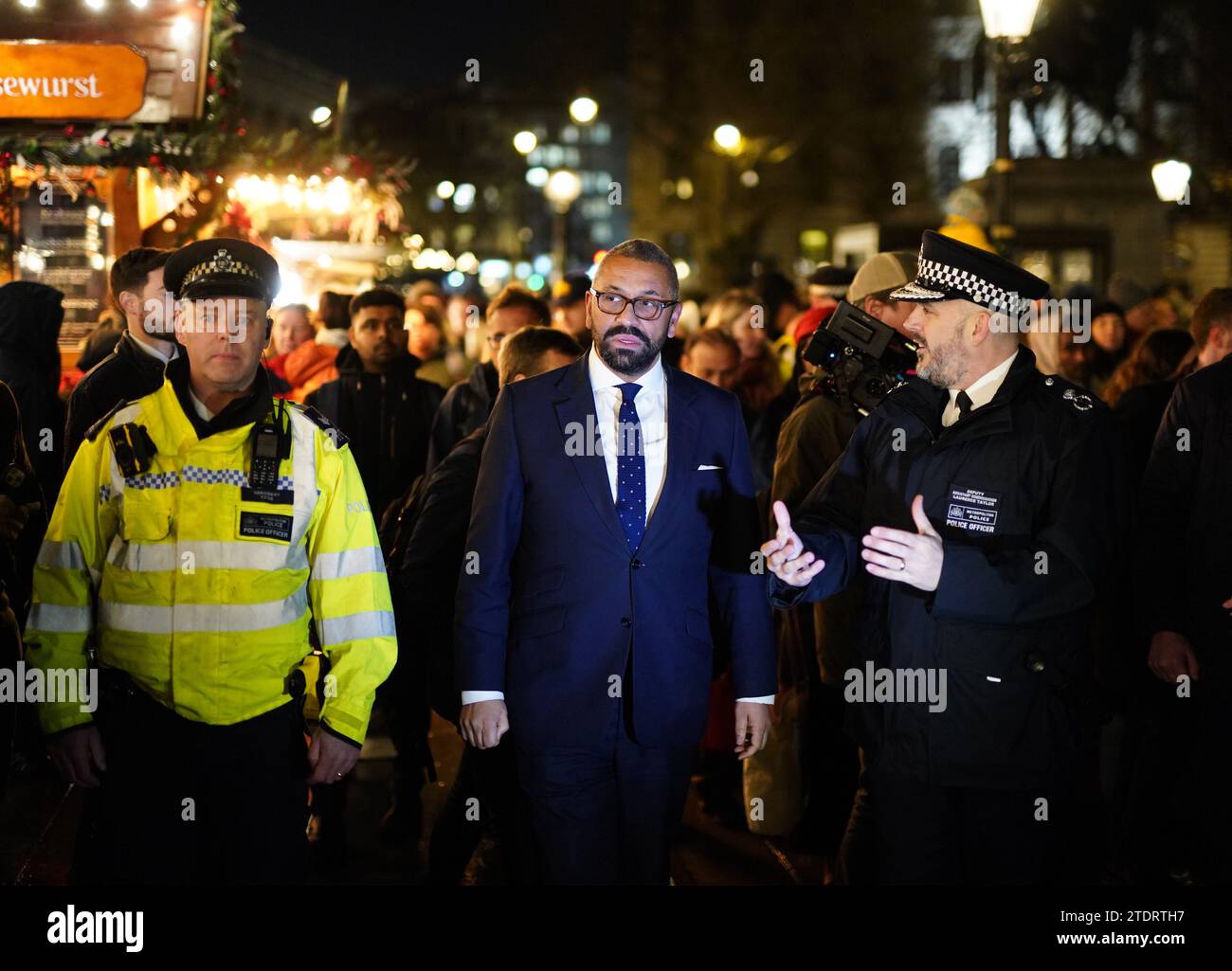 Home Secretary James Cleverly (centre) with Deputy Assistant ...