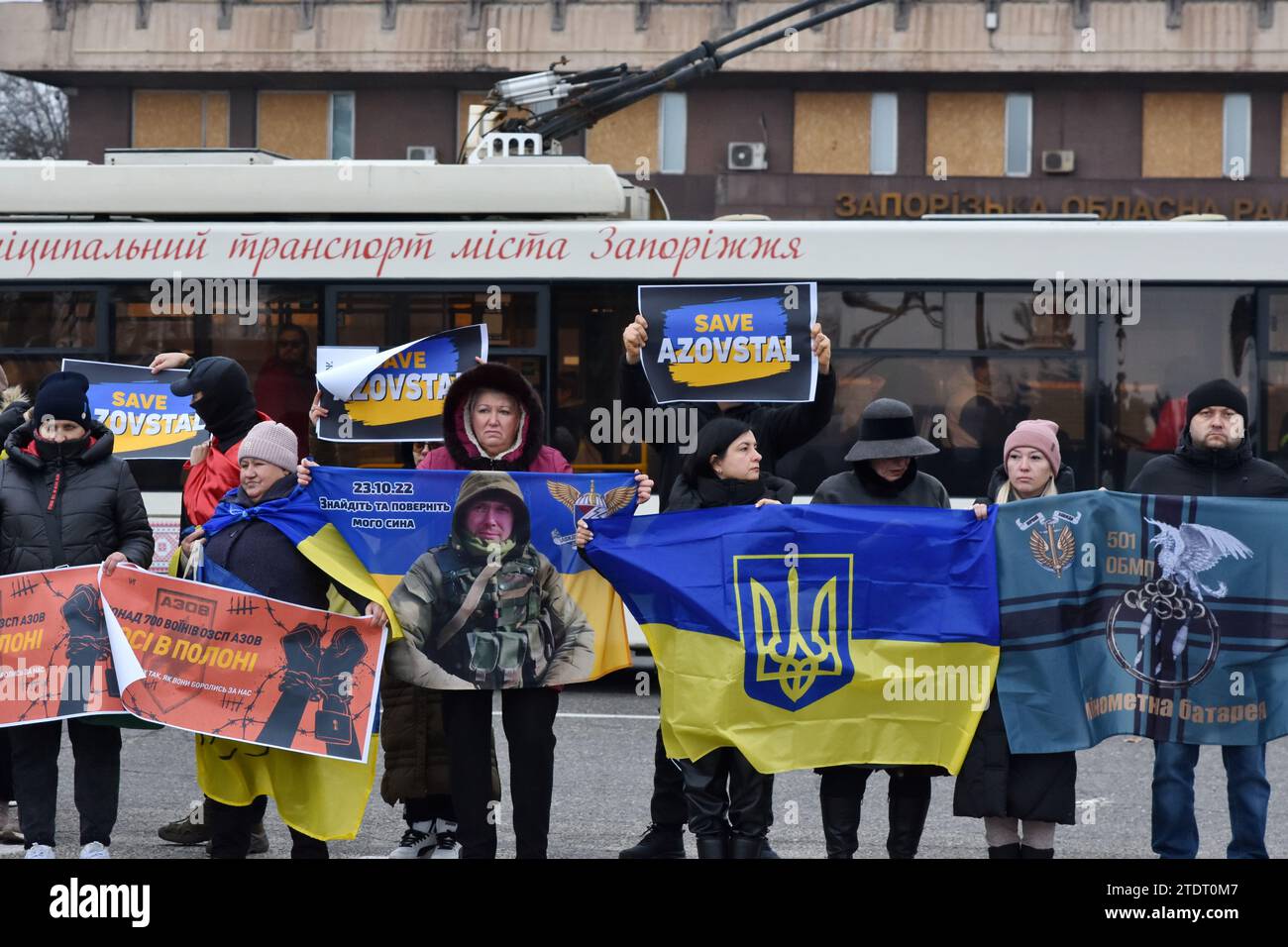 Protesters hold placards and banners during the demonstration in ...