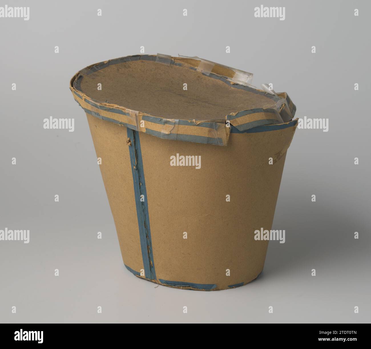 Cone -shaped box of cardboard, decorated with blue piping; intended for ...