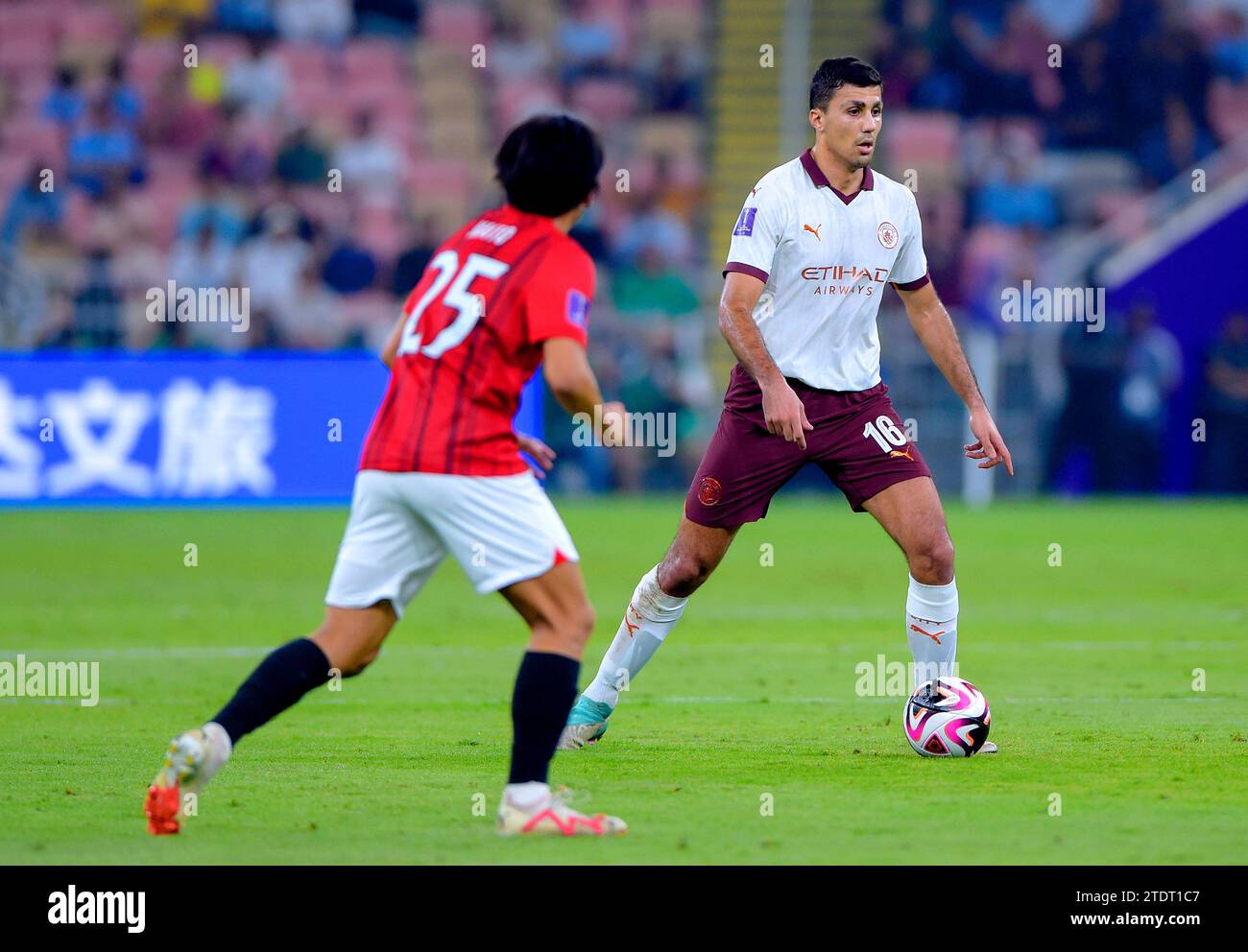 Manchester City's Rodri (right) controls the ball during the FIFA World ...