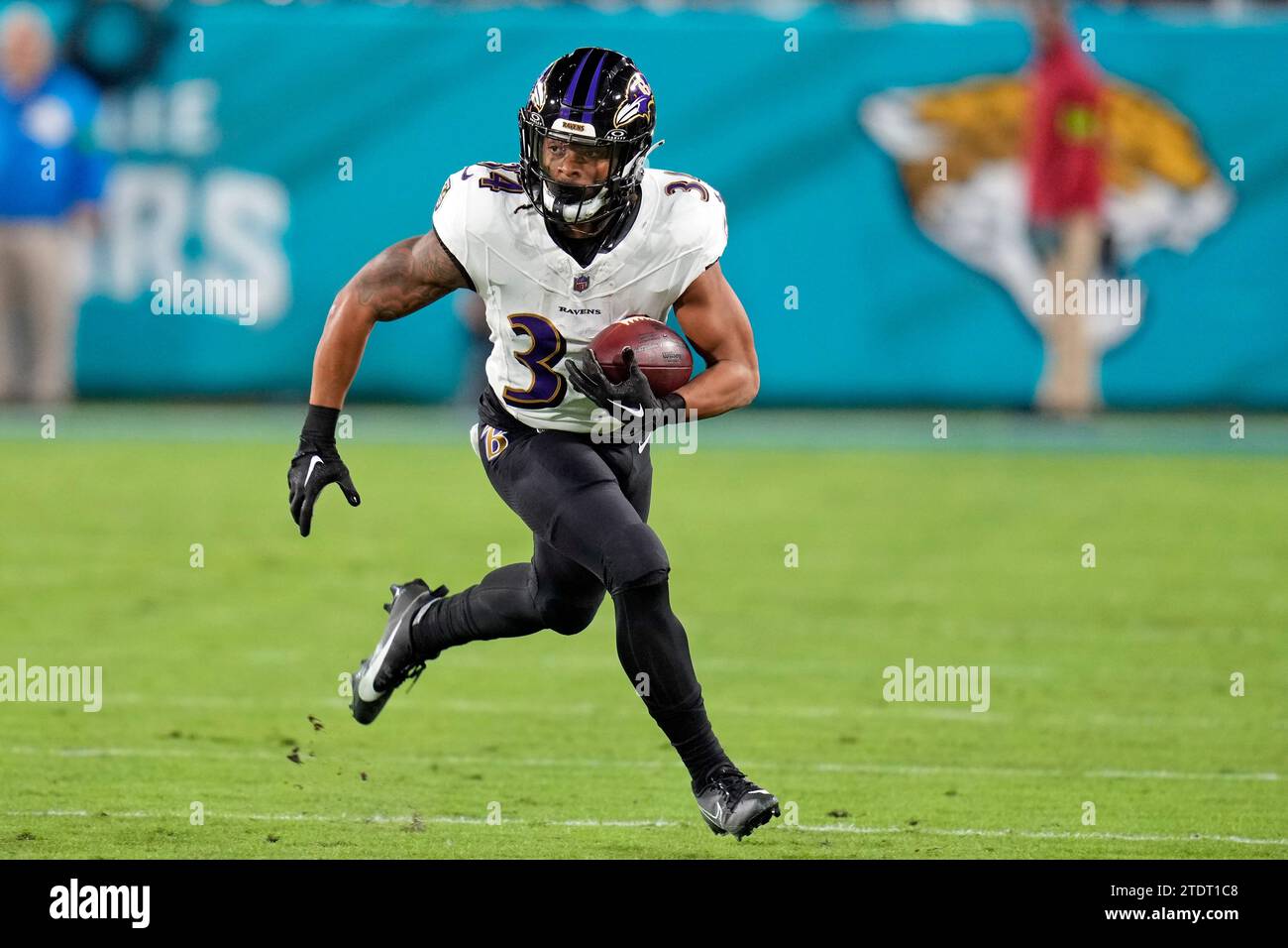 Baltimore Ravens running back Keaton Mitchell (34) gains yardage ...