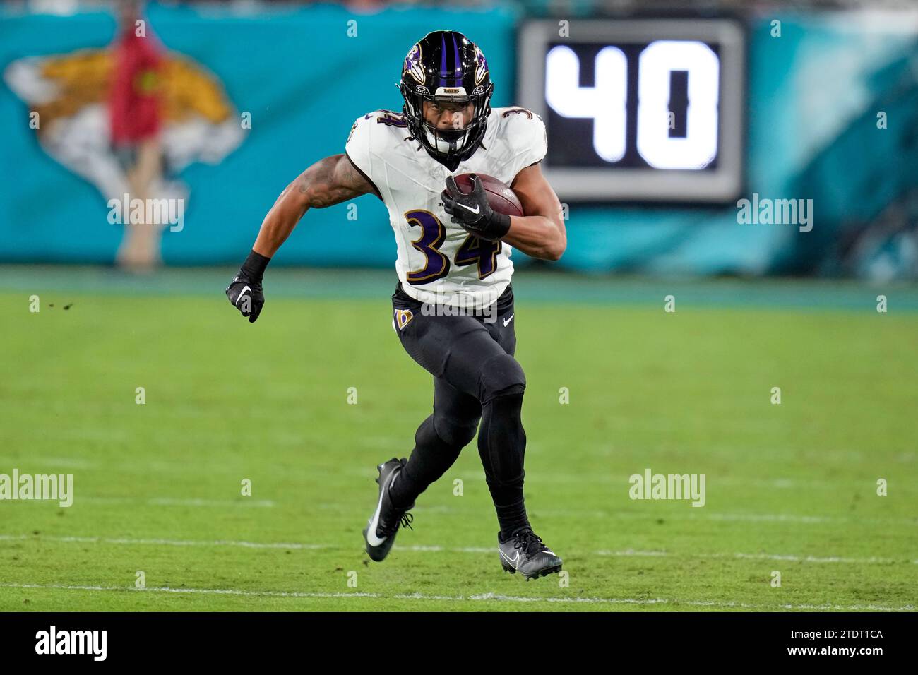 Baltimore Ravens running back Keaton Mitchell (34) gains yardage ...