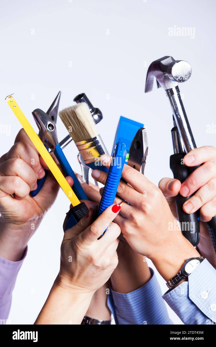 Group of people hands with lots of house improvement tools (selective ...