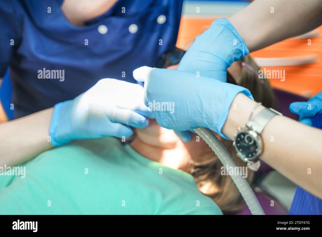 Little scared girl sitting in chair in dentist doctor office ...