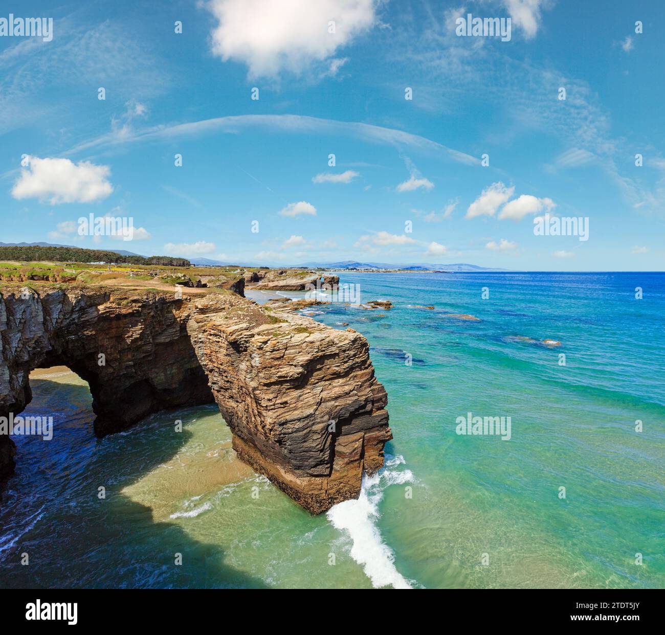 Natural rock arches on Cathedrals beach in low tide (Cantabric coast ...