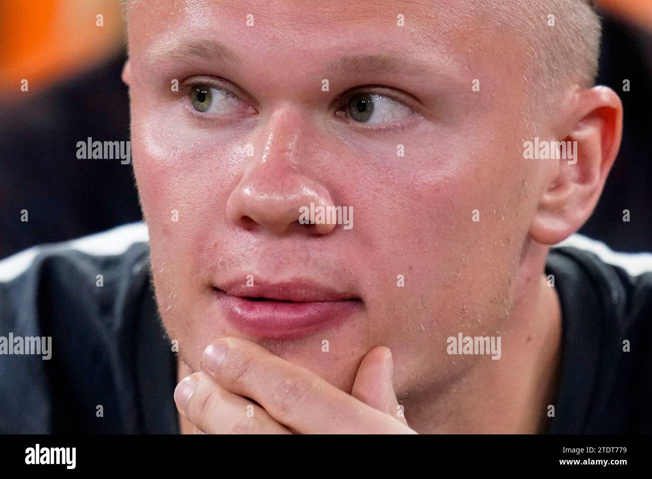 Manchester City's Erling Haaland, siting on the stands, watches the ...