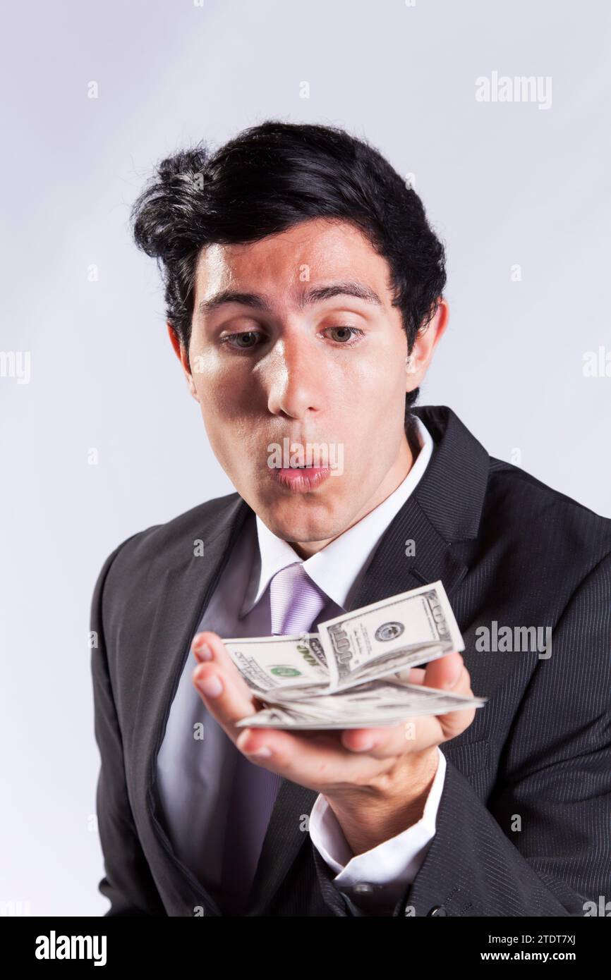 Businessman money falling hi-res stock photography and images - Alamy