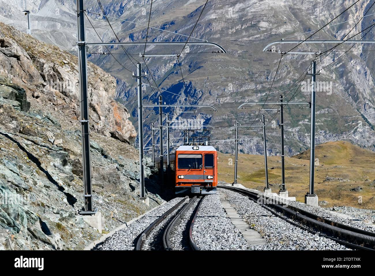 Gornergrat red tourist train with the Matterhorn peak panorama in Swiss ...