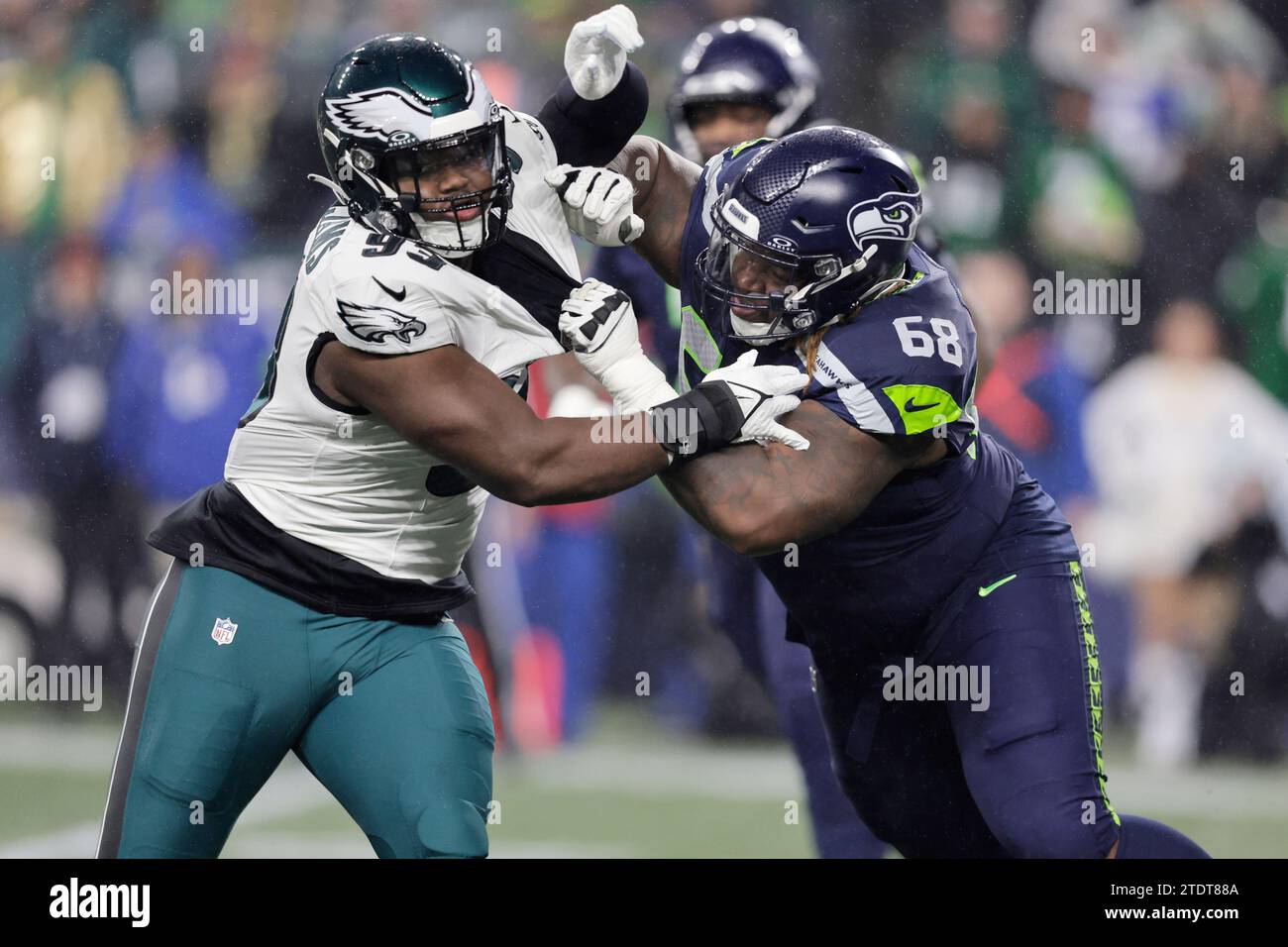 Philadelphia Eagles defensive tackle Milton Williams, left, blocks ...