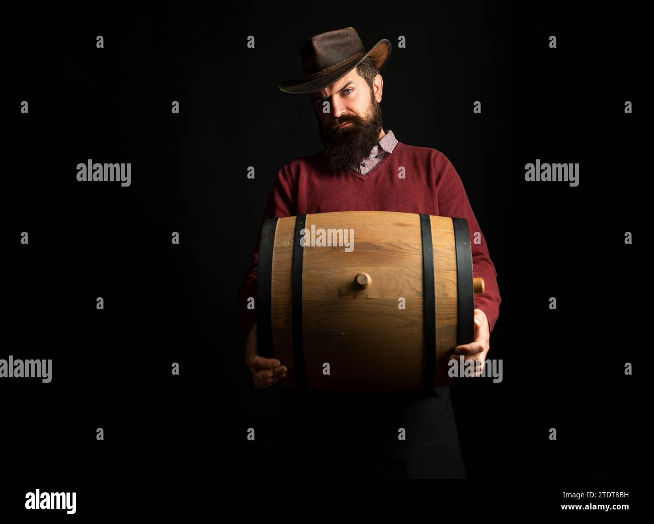 Man hold wooden barrel on black. Oktoberfest. Bearded brewer man ...