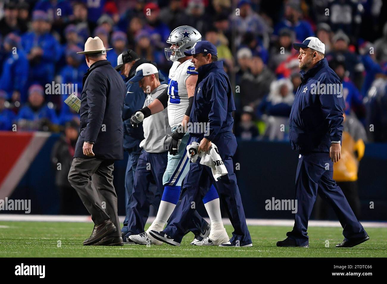 Dallas Cowboys guard Zack Martin (70) walks off the field with medical ...