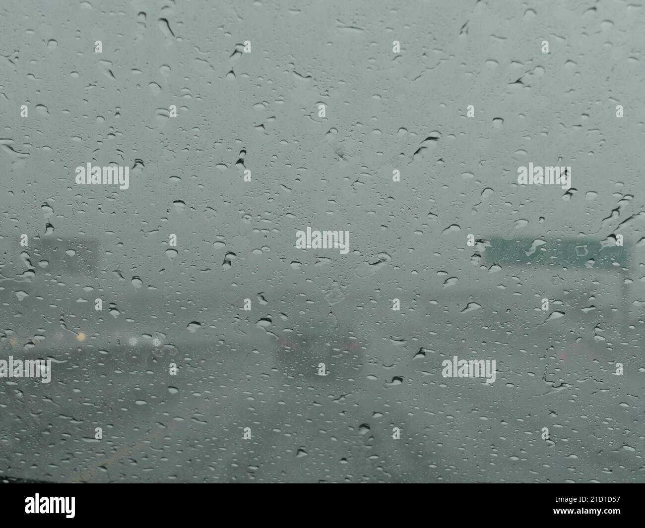 View on highway through wet window Stock Photo - Alamy