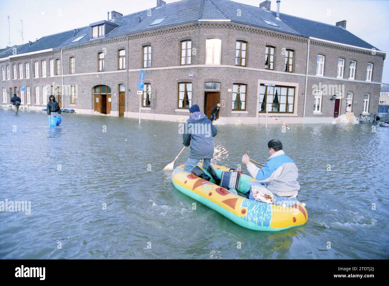 Flood Limburg, Roermond (people in plastic children's boat in flooded ...