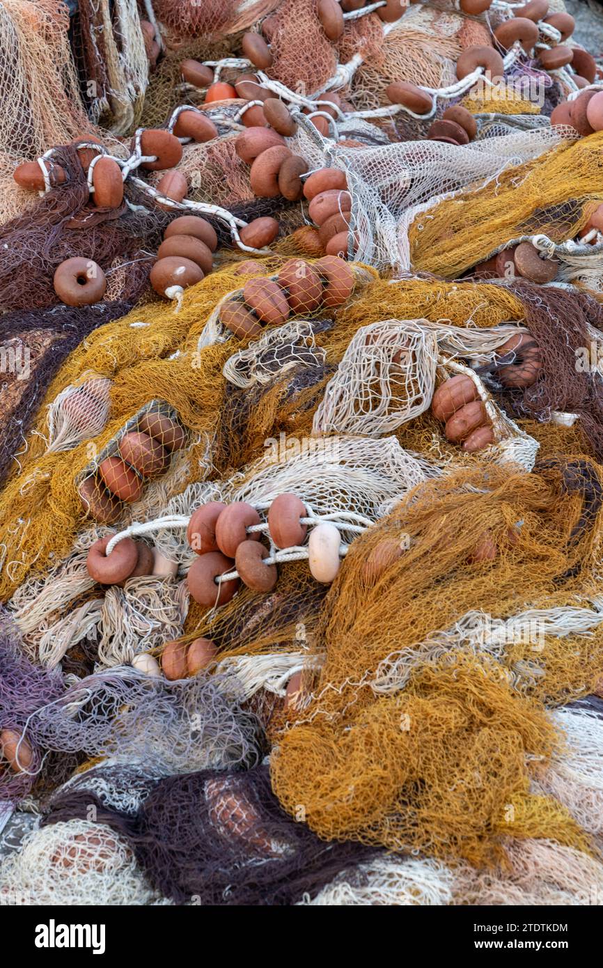 A close-up detail view of floats and fishing nets for trawlers in many ...
