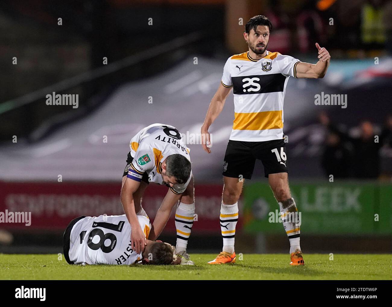 Burslem, UK. 19th Dec, 2023. JASON LOWE of Port Vale signals for help ...