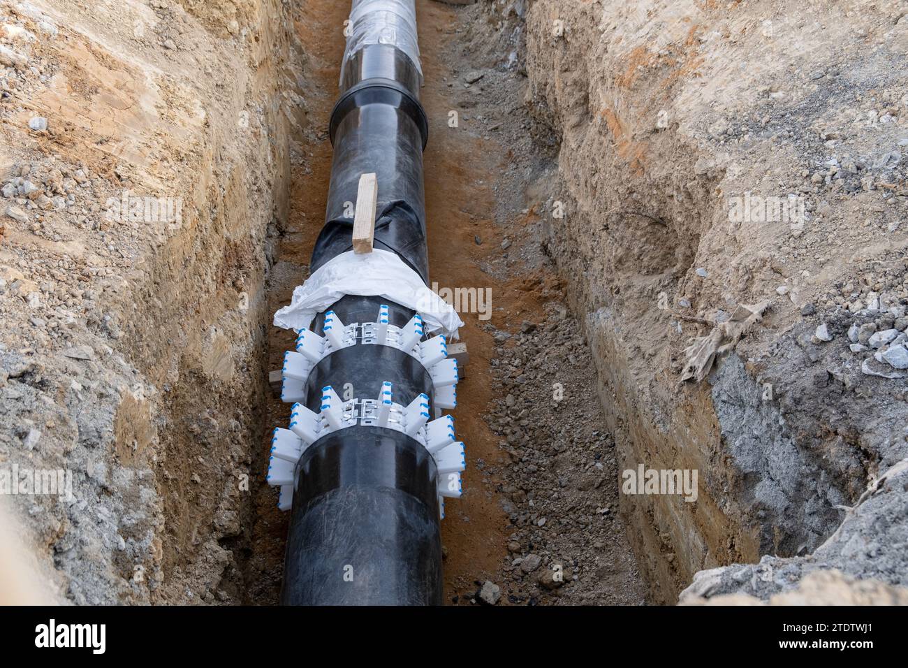 Digged heating pipes in a construction site. Install underground ...