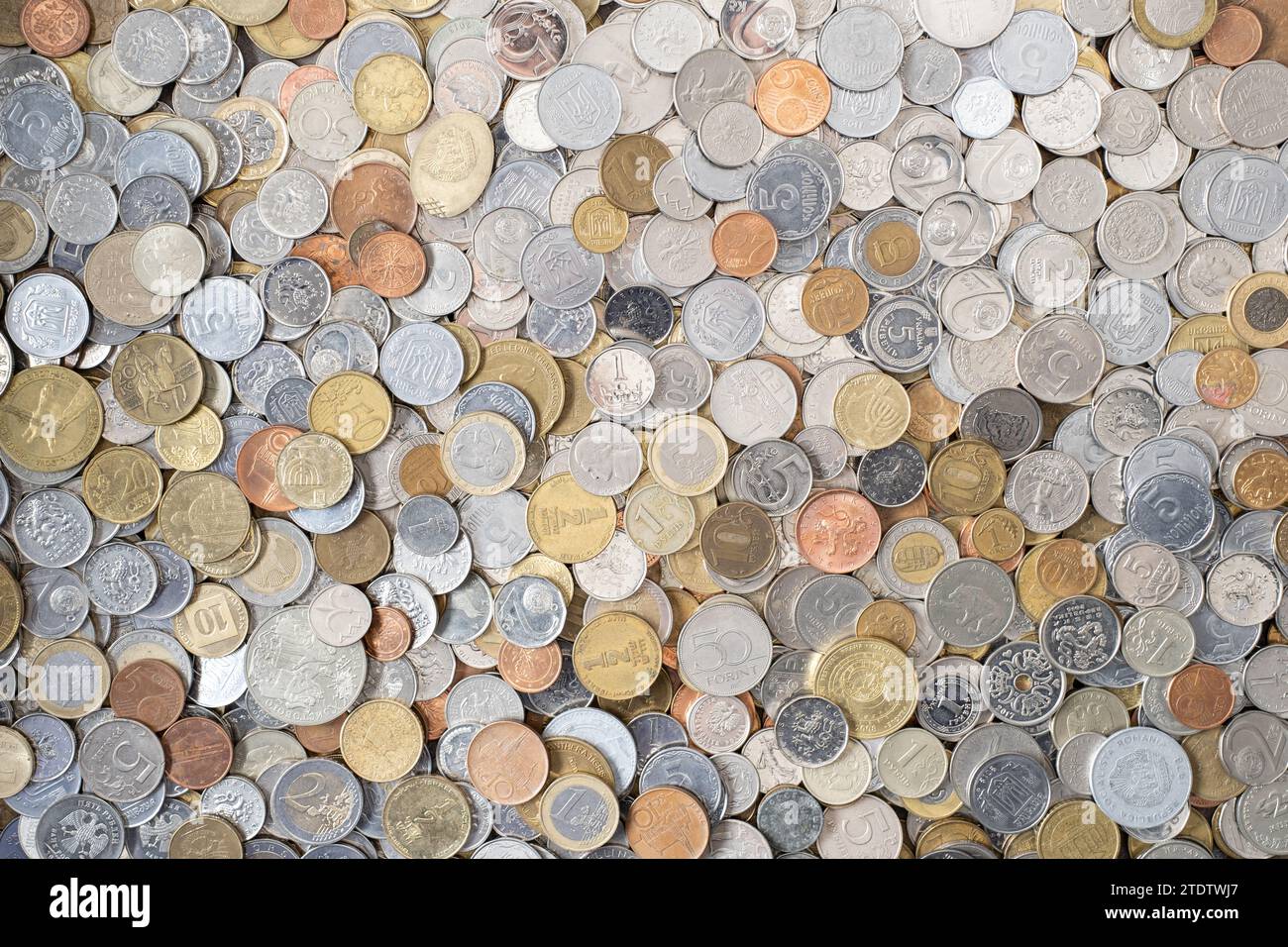 A heap of various money coins of different denominations from different ...