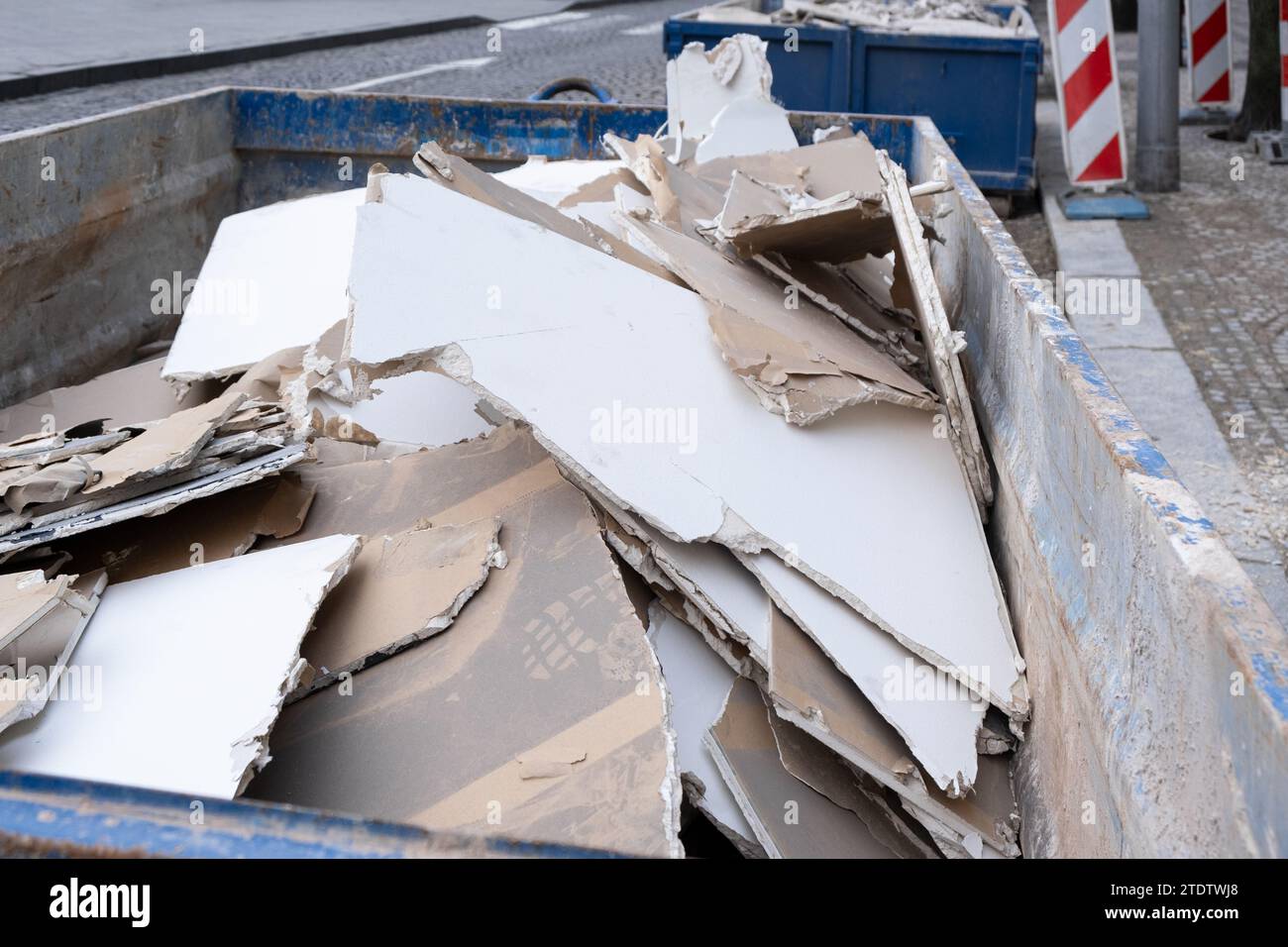 dumpster waste container with construction waste and drywall ...