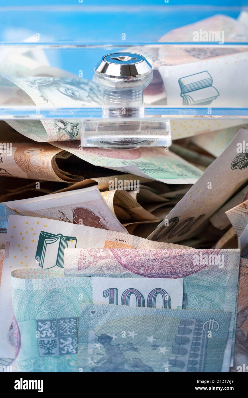 Charity and money banknotes in a transparent donation box for money ...