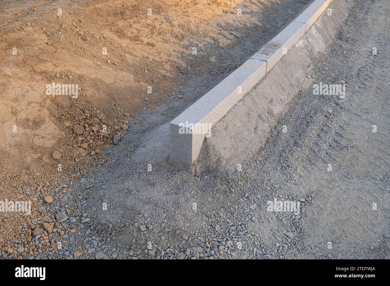 Concrete curb border laid on cement. road safety Pavement construction ...