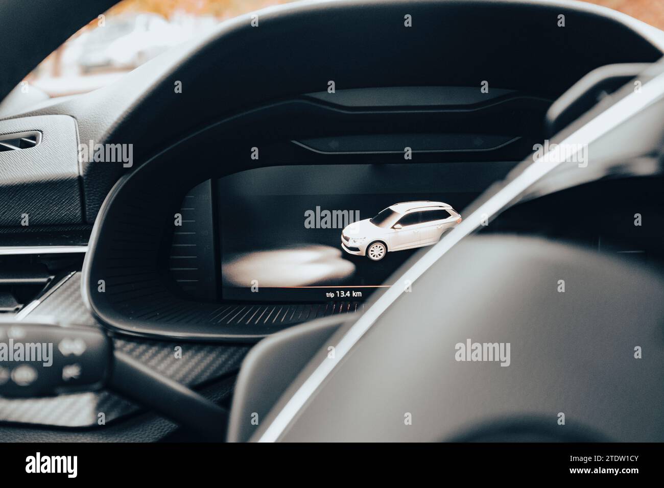 Lcd screen cockpit in a modern car carbon fibers interior close up ...