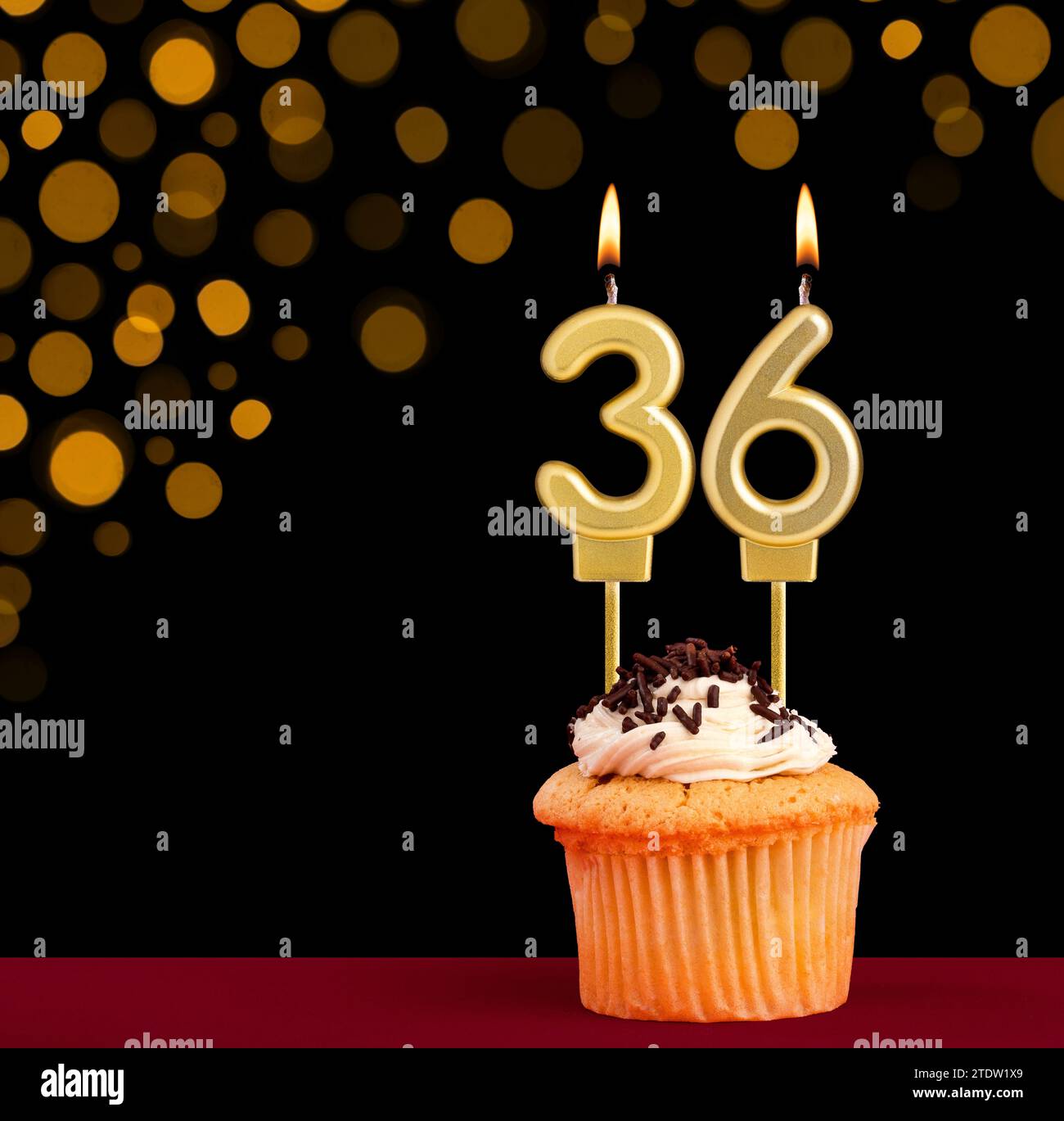 Birthday candle with cupcake - Number 36 on black background with out ...