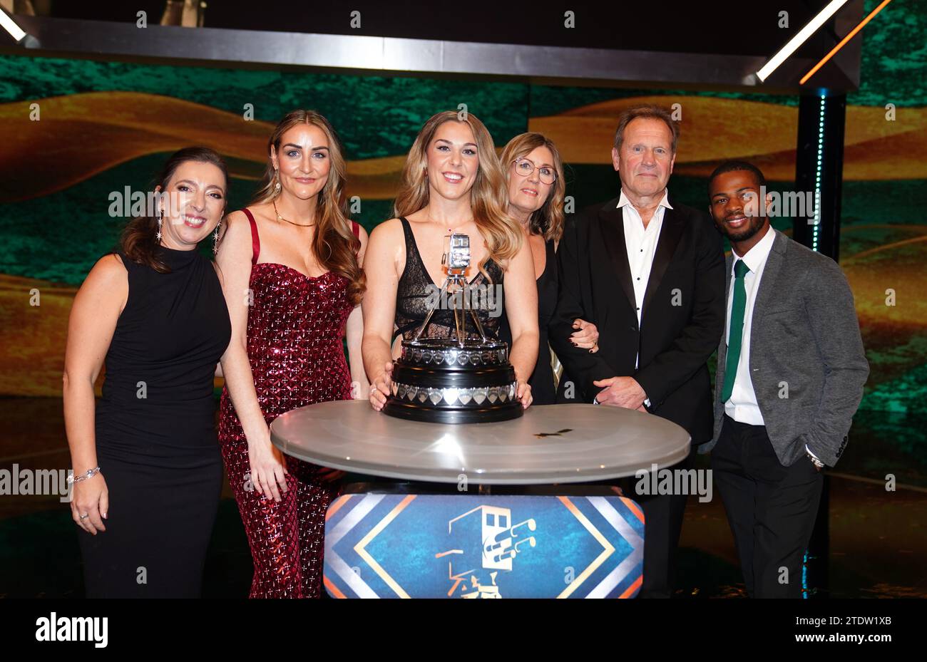 Mary Earps poses with the trophy alongside friend's and family after ...