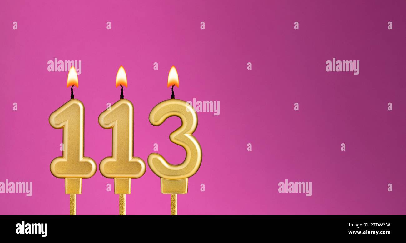 Candle number 113 in purple background - birthday card Stock Photo - Alamy