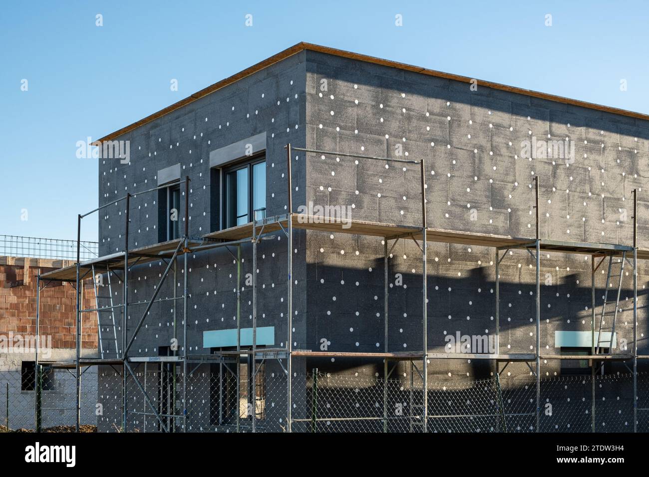 New House building in process insulation of the wall of the house with ...
