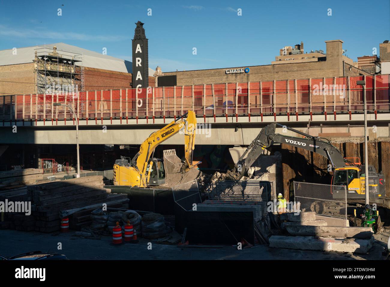 Construction crews work to remove the embankment wall along the Chicago ...