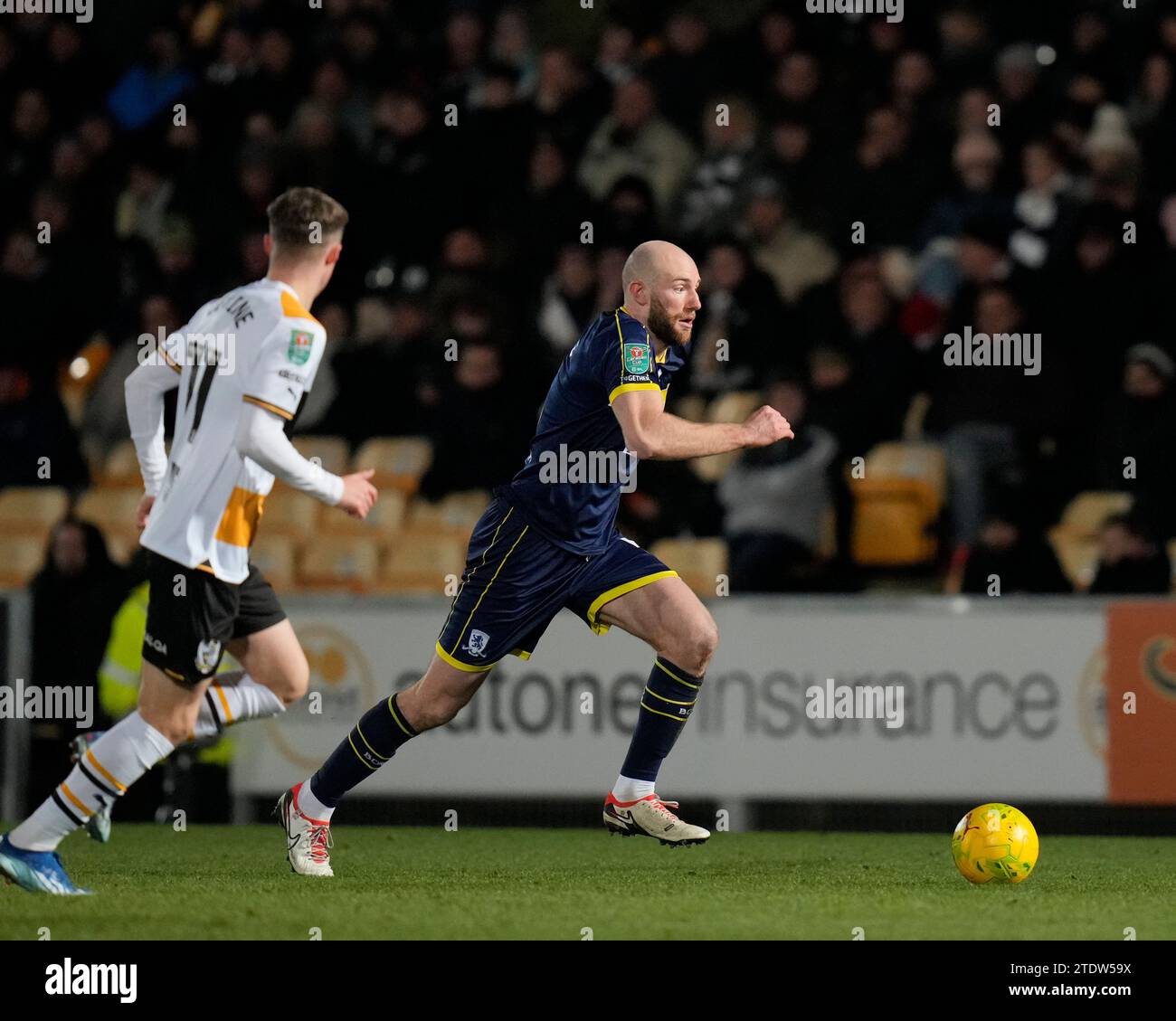 Matthew Clarke #5 of Middlesbrough rubs past Alfie Devine #11 of Port ...
