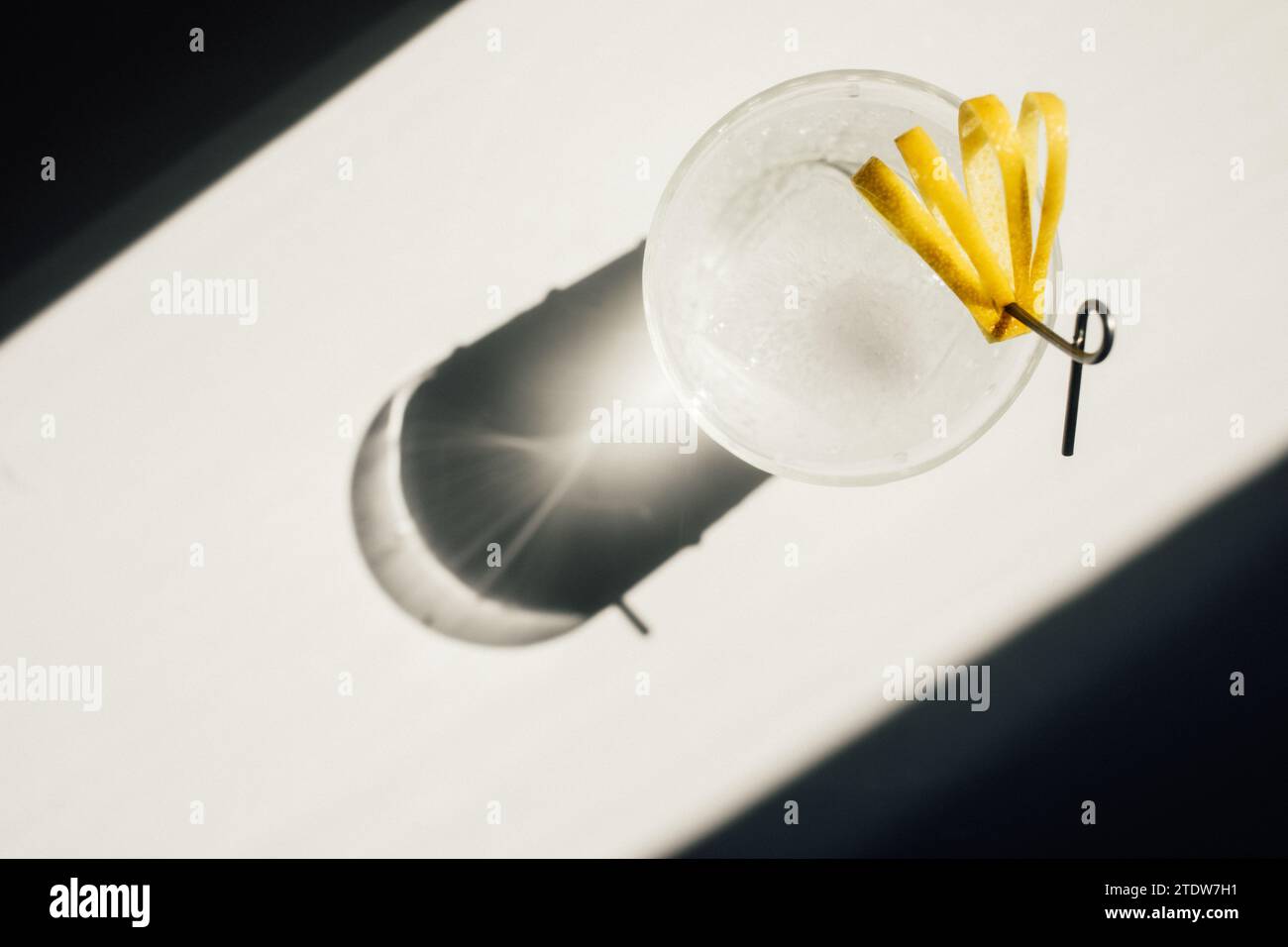 soda water with ice and cut lemon peel garnish on cocktail pick in the ...
