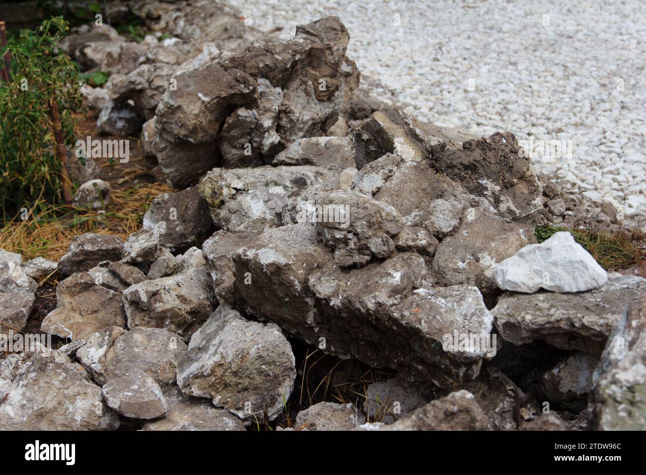 Big cobblestones lie on side of road. Process of repairing and ...
