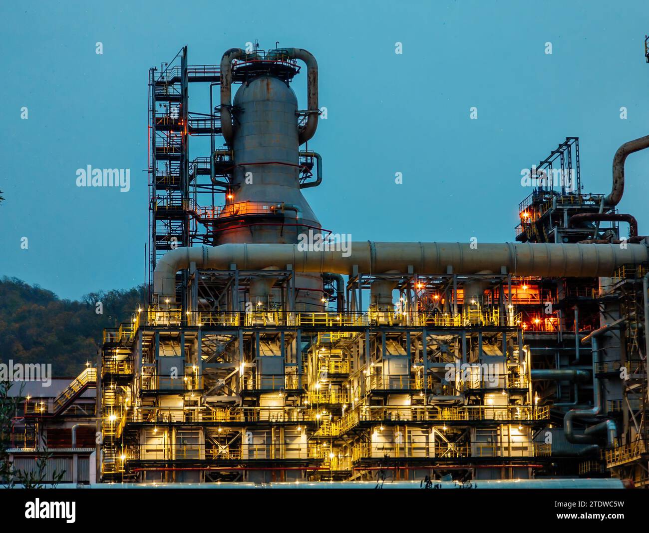 Chemical factory at night. Rectification towers Stock Photo - Alamy
