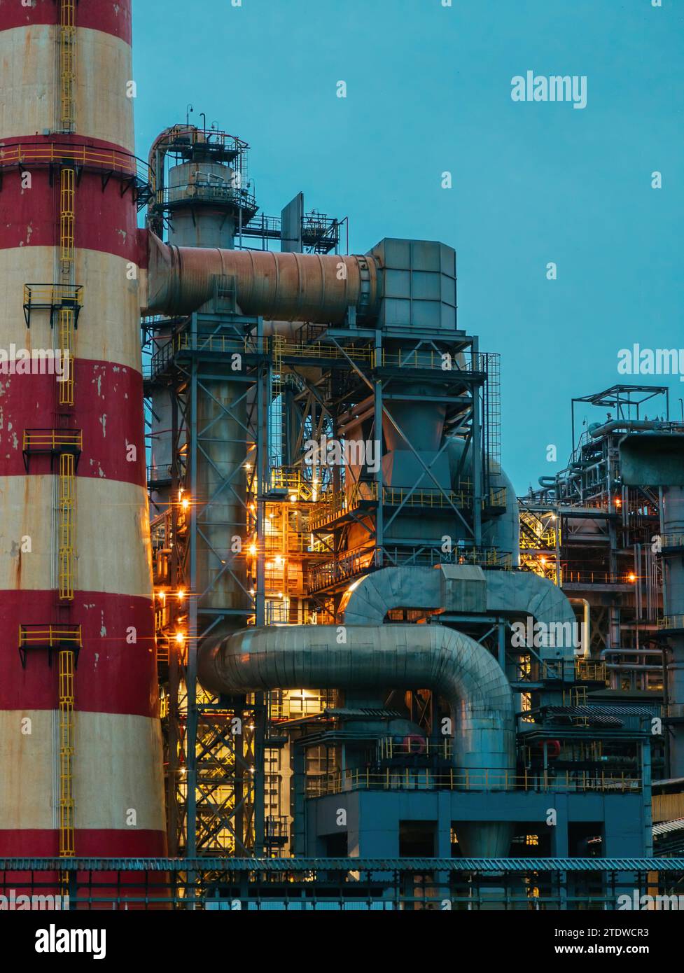 Chemical factory at night. Rectification towers Stock Photo - Alamy