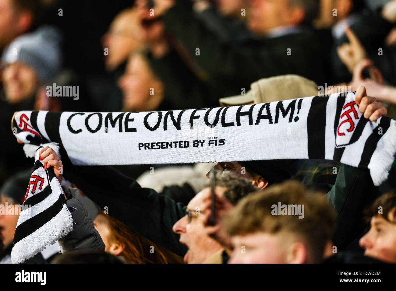 Liverpool, UK. 19th Dec, 2023. Fulham fans hold up scarves after ...