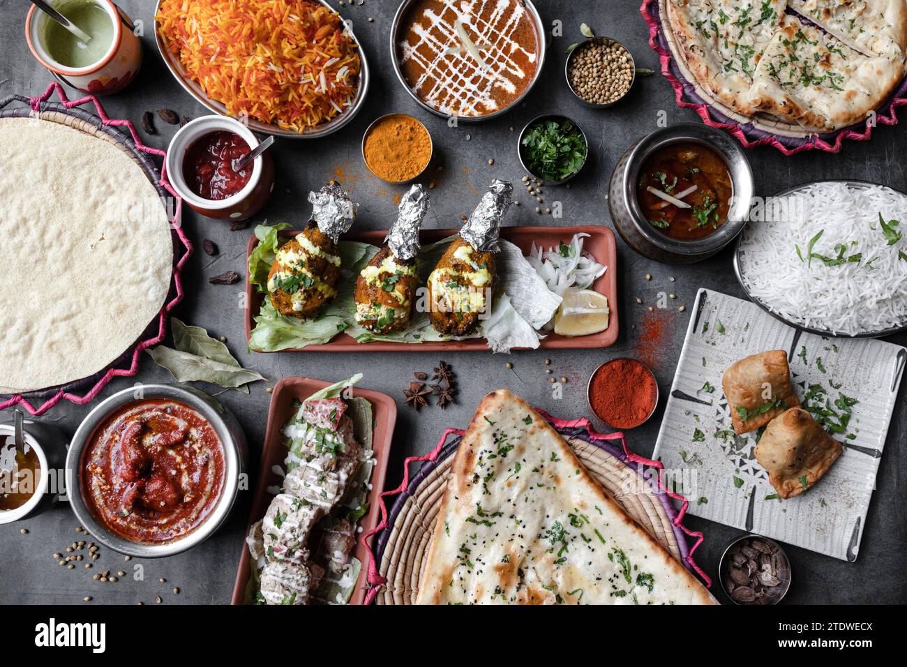Variety of Indian food dishes on restaurant table Stock Photo - Alamy