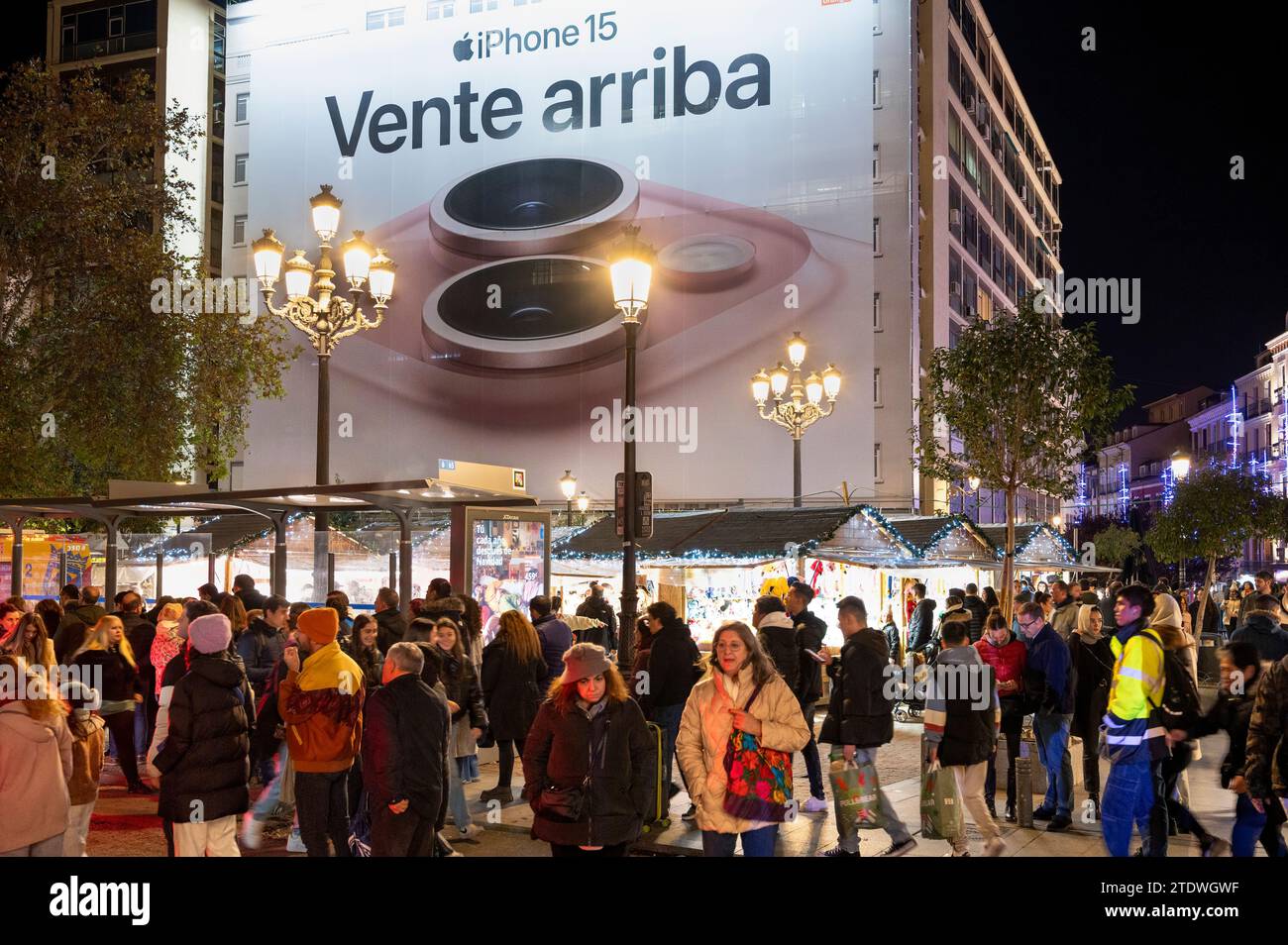 Madrid, Spain. 19th Dec, 2023. Pedestrians and shoppers walk through a ...