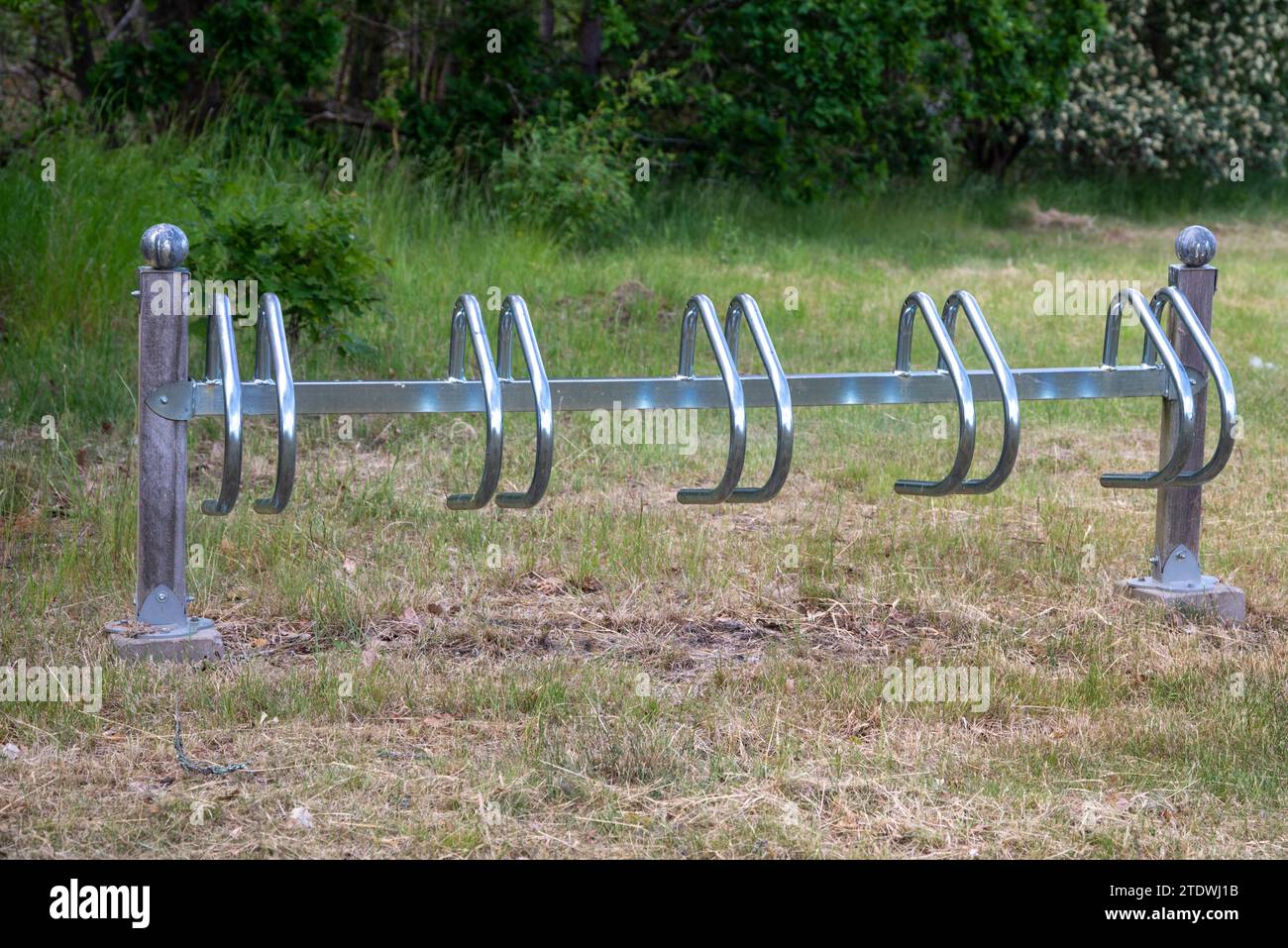 bike wheel racks of gray sheet metal tubes in the shape of a rectangle ...
